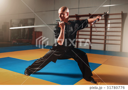 Wushu master training with sword, martial arts | materials | digitalstage